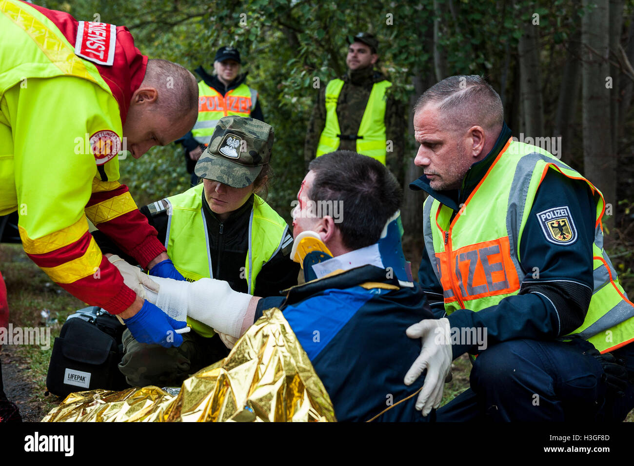 Polish and German border guards assist the emergency services during a ...