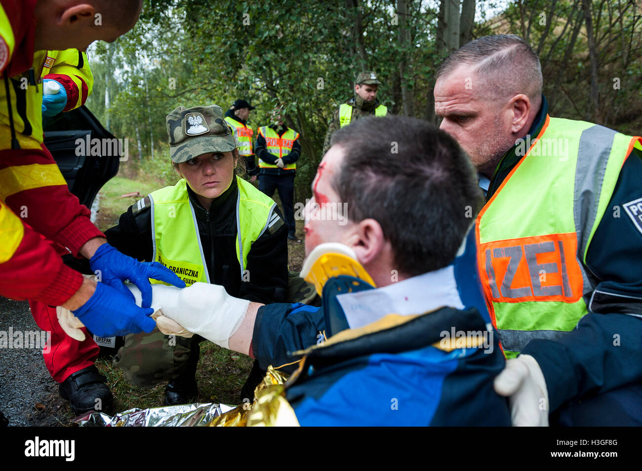 Polish and German border guards assist the emergency services during a ...