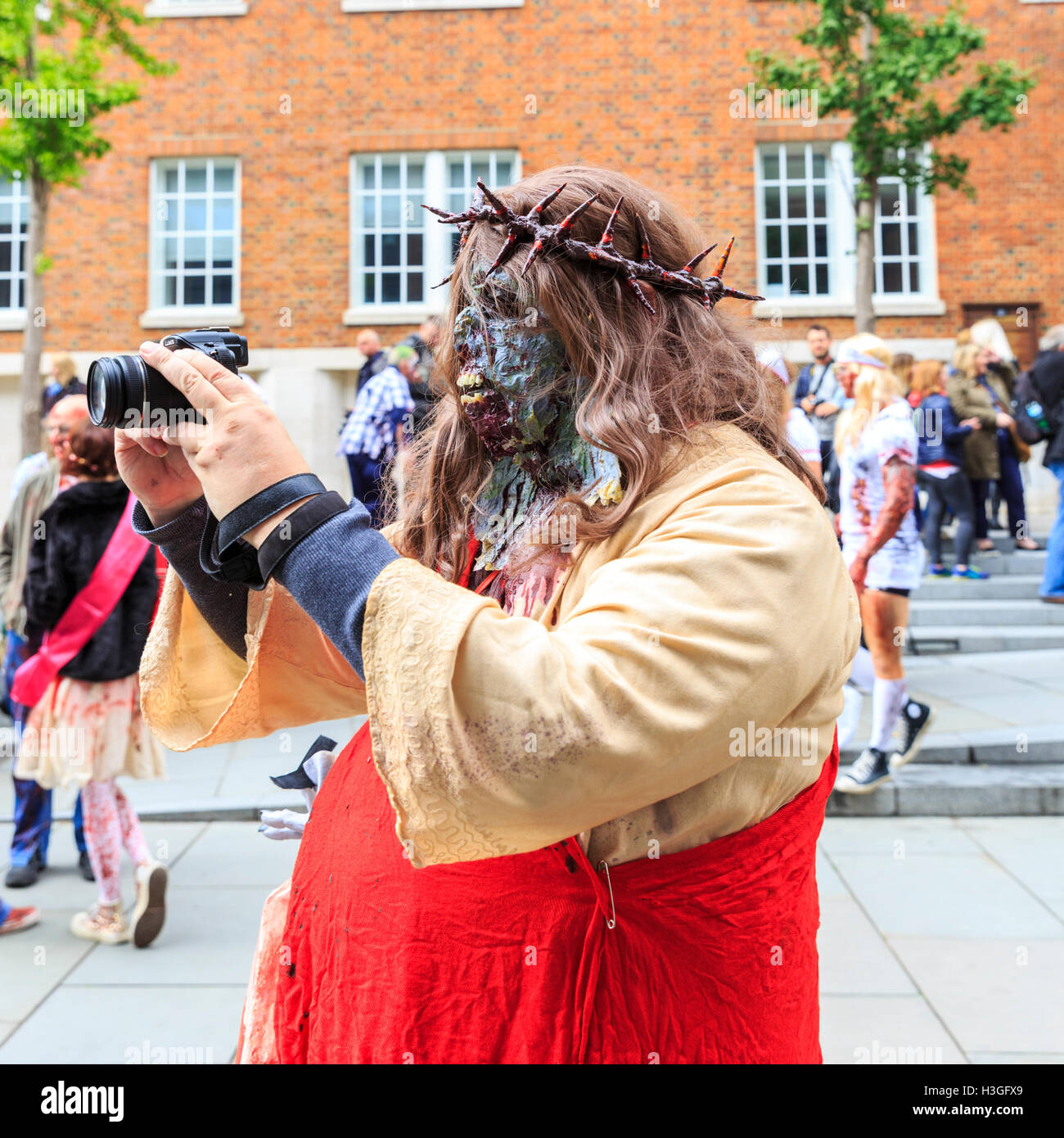 London, UK. 8th Oct 2016. Hundreds of people dressed as Zombies roam ...