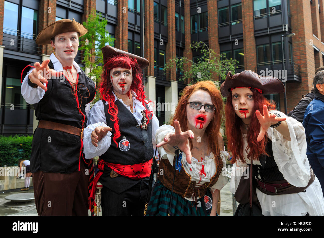 London, UK. 8th Oct 2016. Hundreds of people dressed as Zombies roam ...
