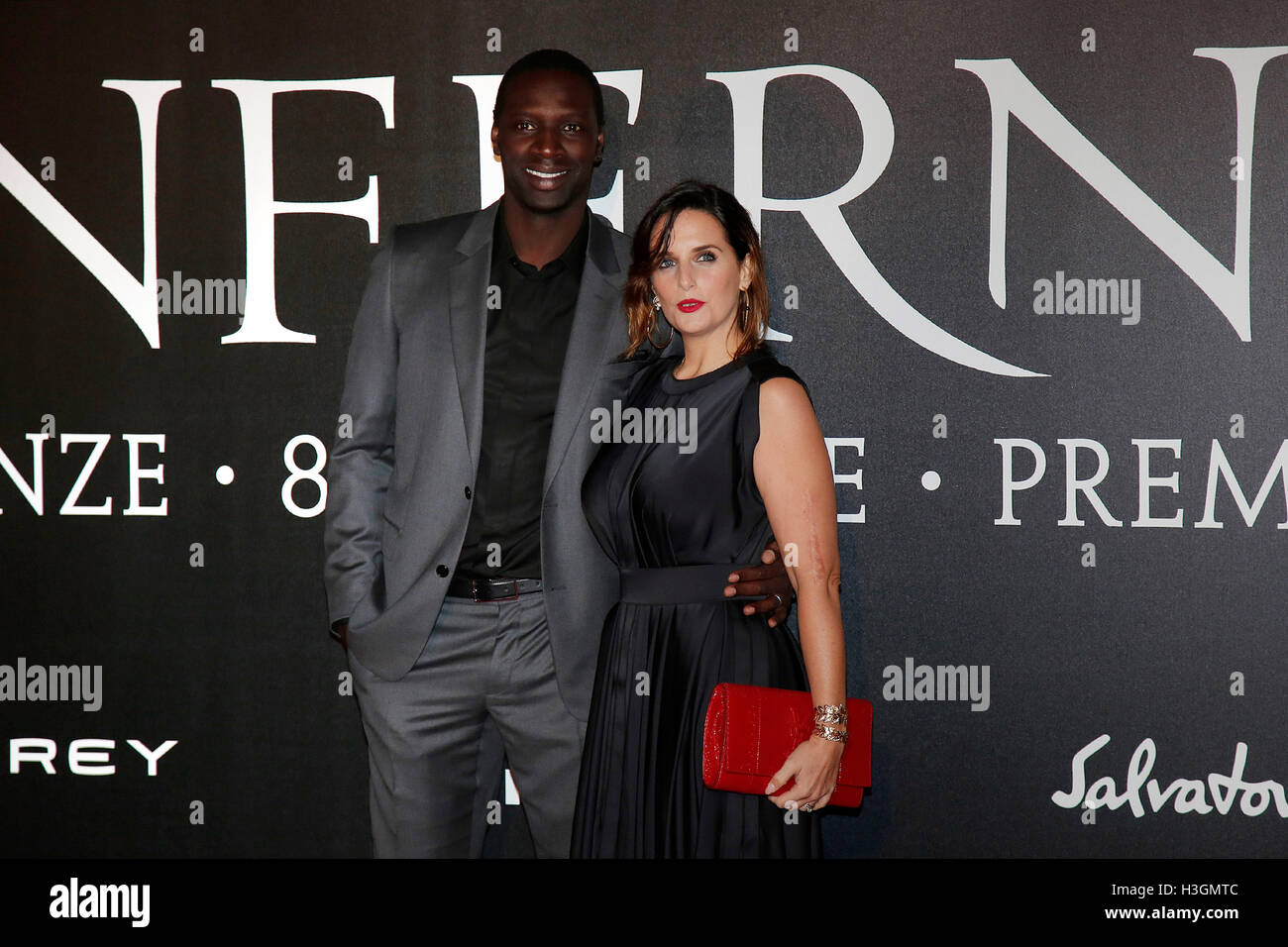 Florence, Italy. 8th October, 2016. Omari Sy and his wife Helene ...