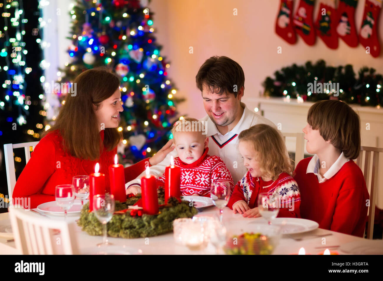 Big family with three children celebrating Christmas at home. Festive ...