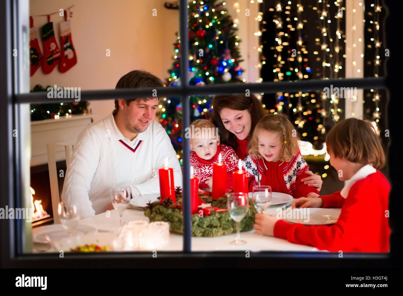 Big family with three children celebrating Christmas at home. Festive ...