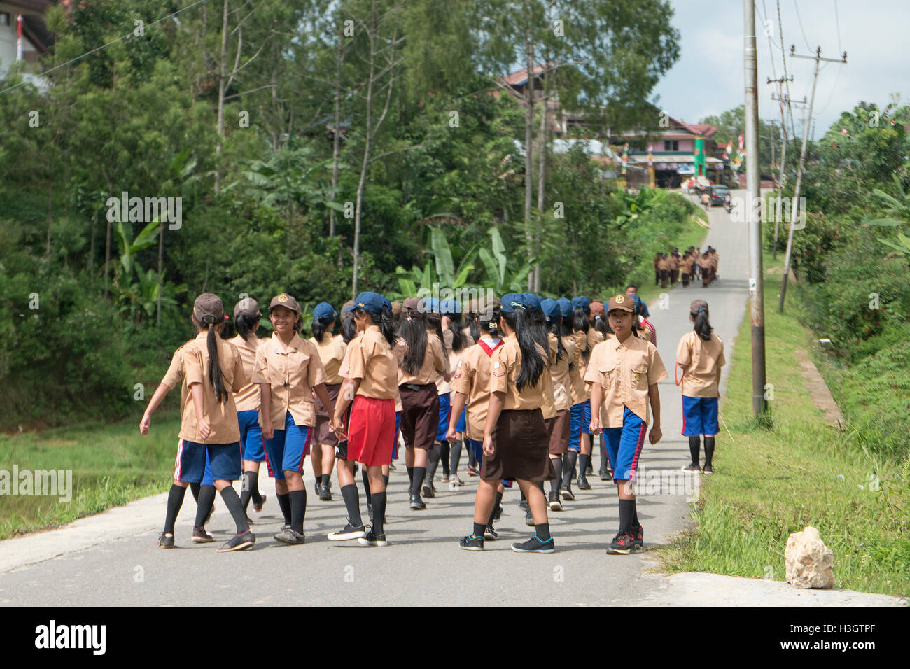 School children with special uniform practice and parade at the road ...