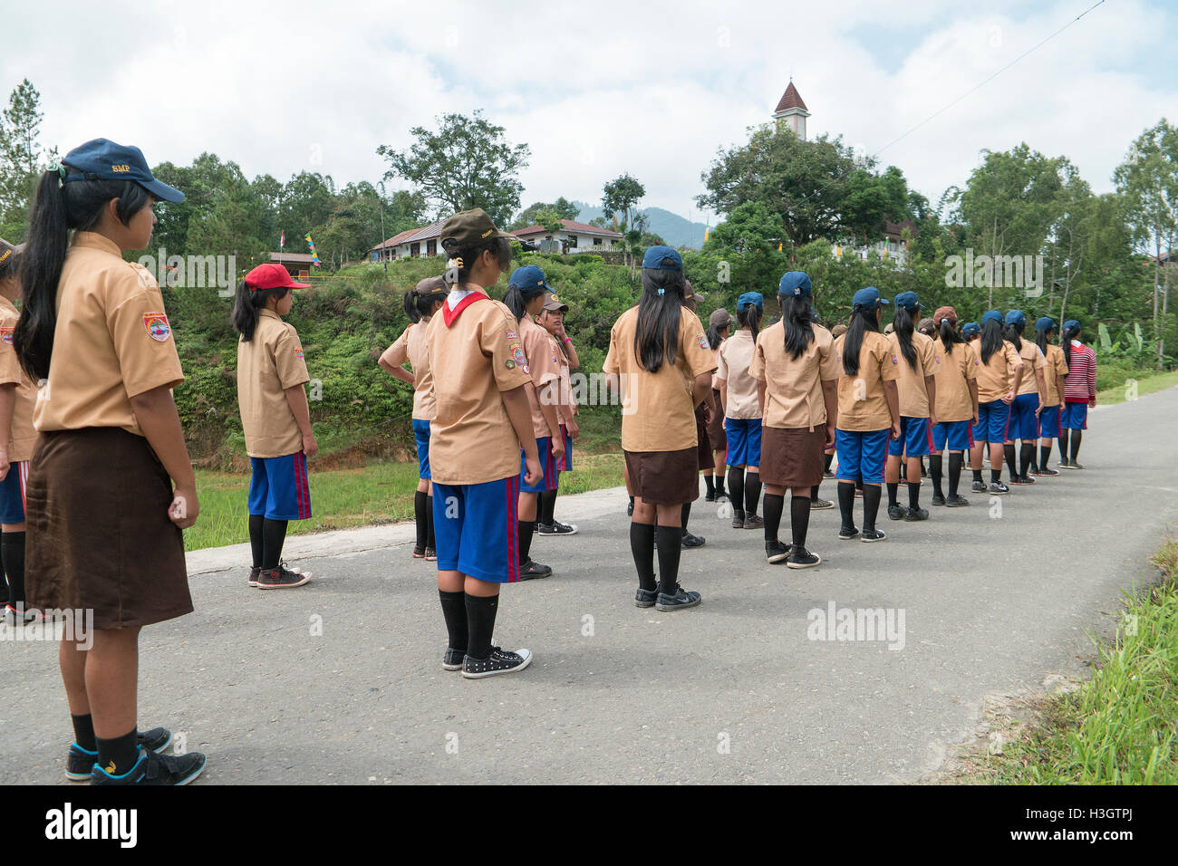 School children with special uniform practice and parade at the road ...