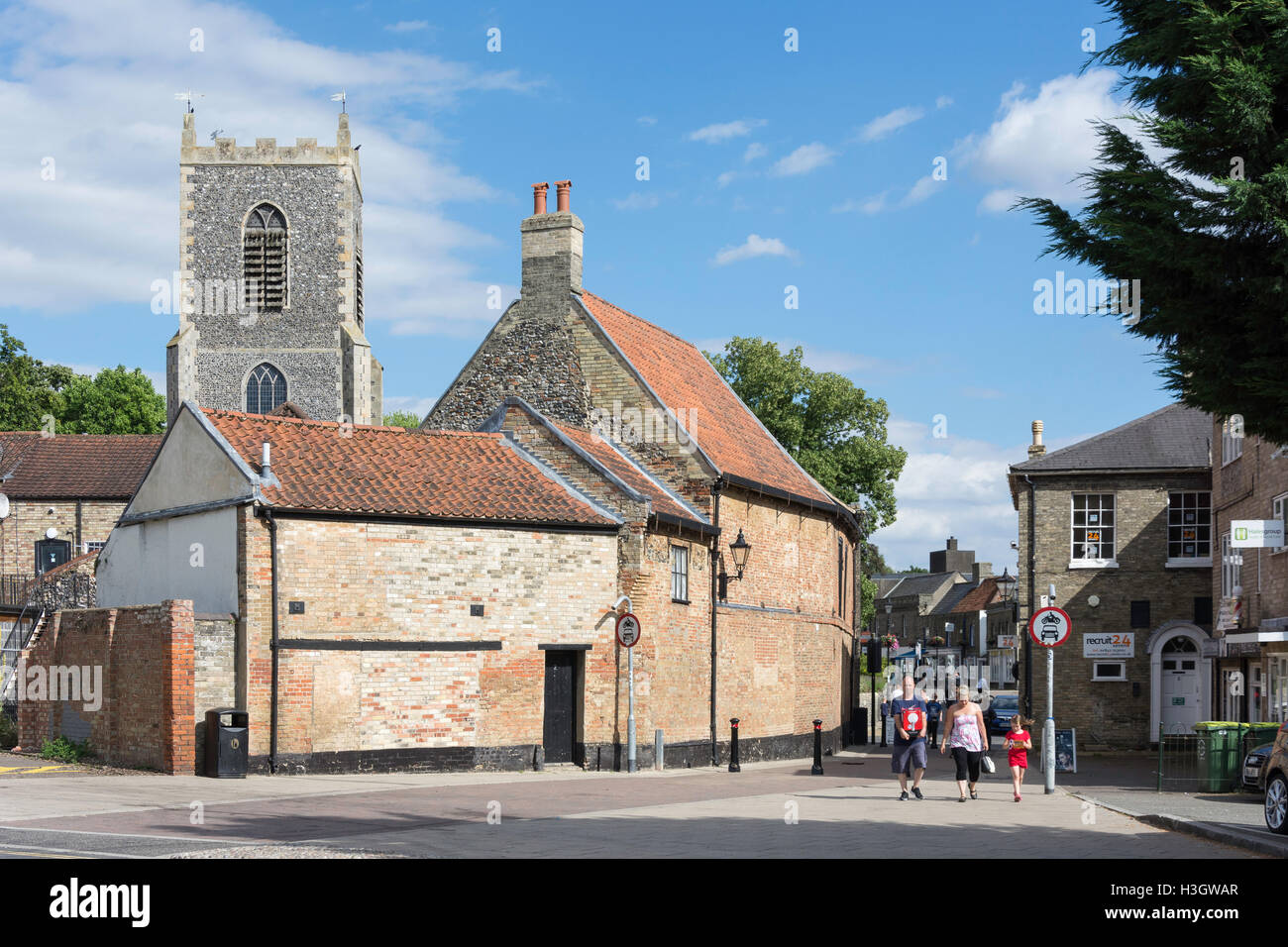 Minstergate showing St Peter's Church tower, Thetford, Norfolk, England ...