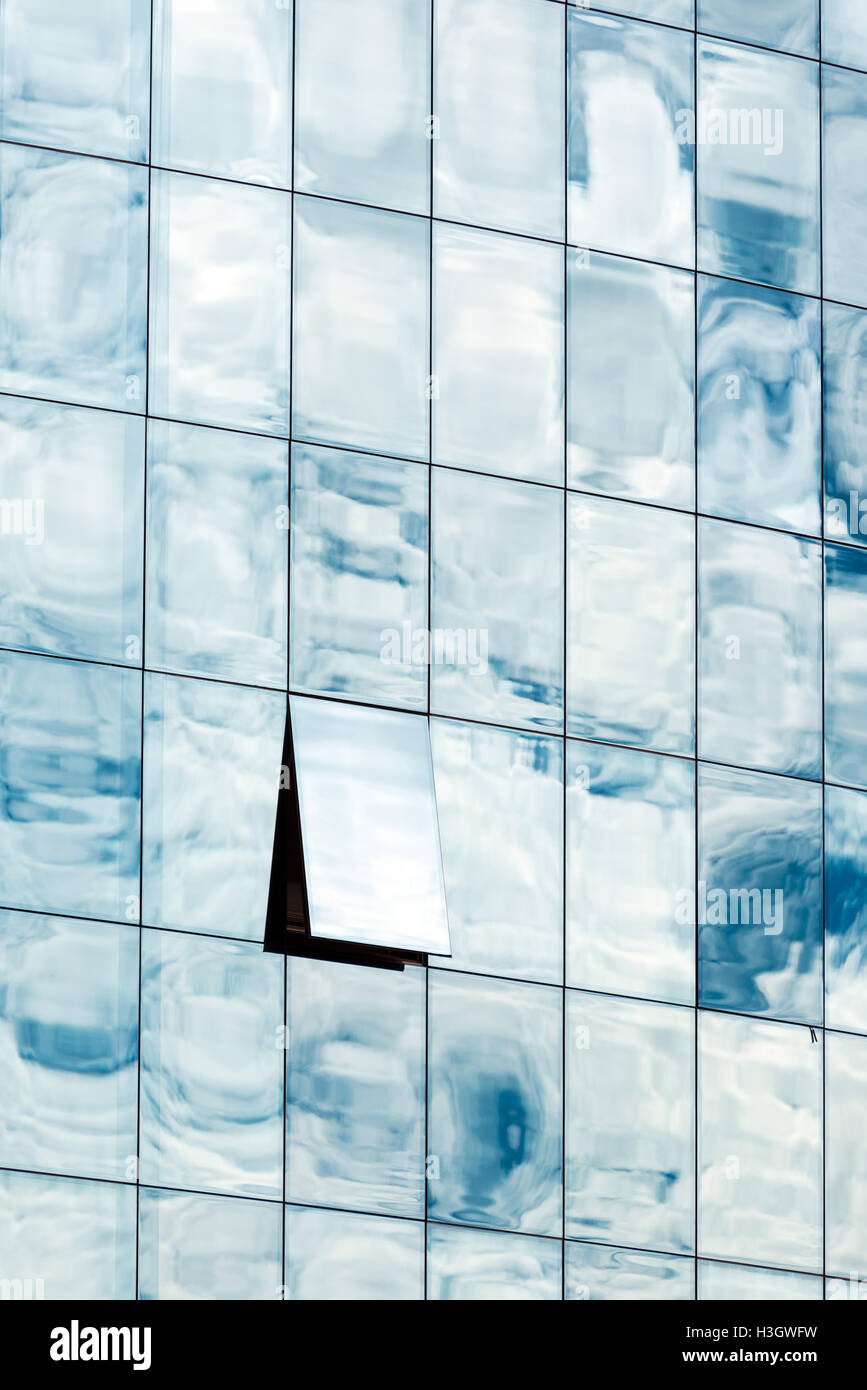 Opened window in the blue skyscraper office building Stock Photo - Alamy