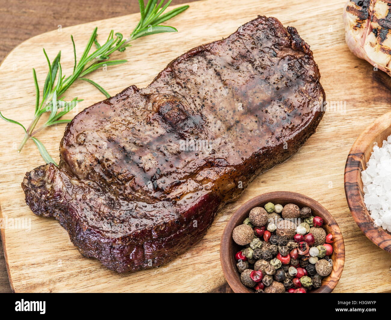 Steak Ribeye with spices on the wooden tray Stock Photo - Alamy