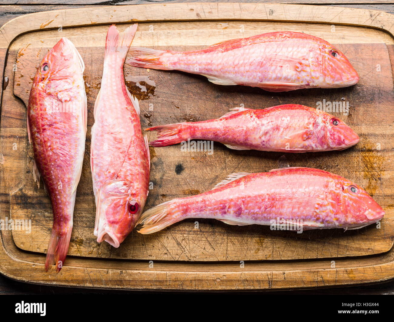 Red mullets on the wooden board Stock Photo - Alamy