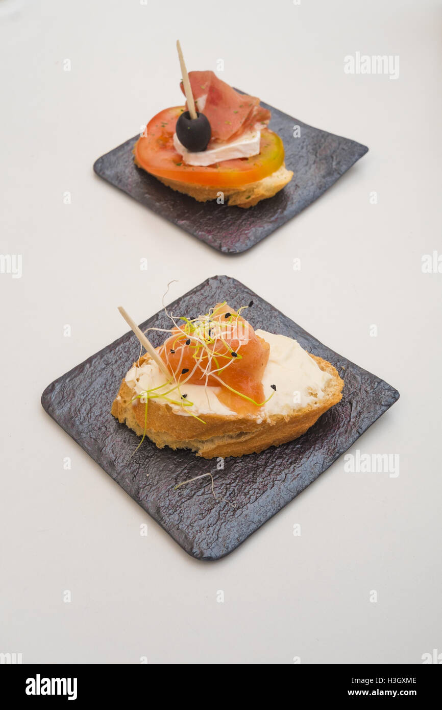 Traditional Spanish tapa, bread with garnish and toothpick Stock Photo ...