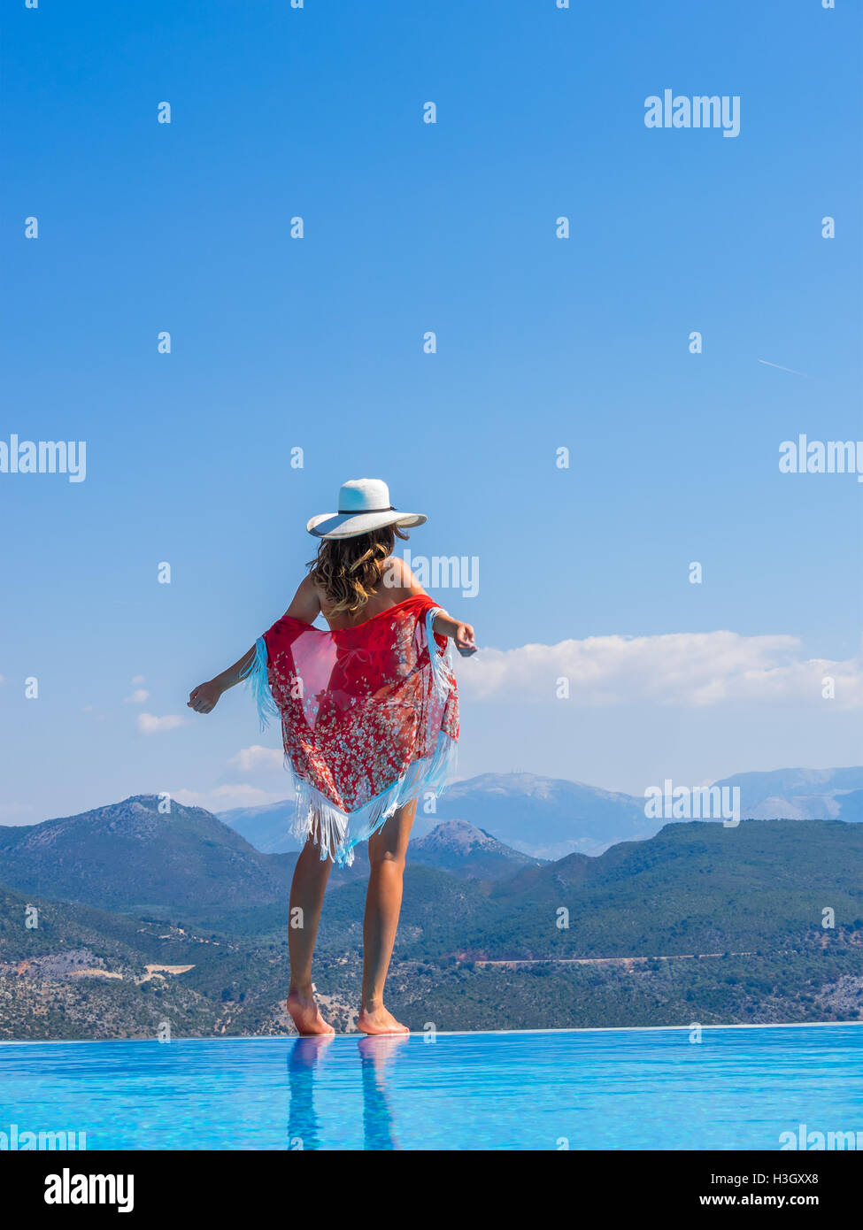 woman on the infinite water - freedom concept Stock Photo - Alamy