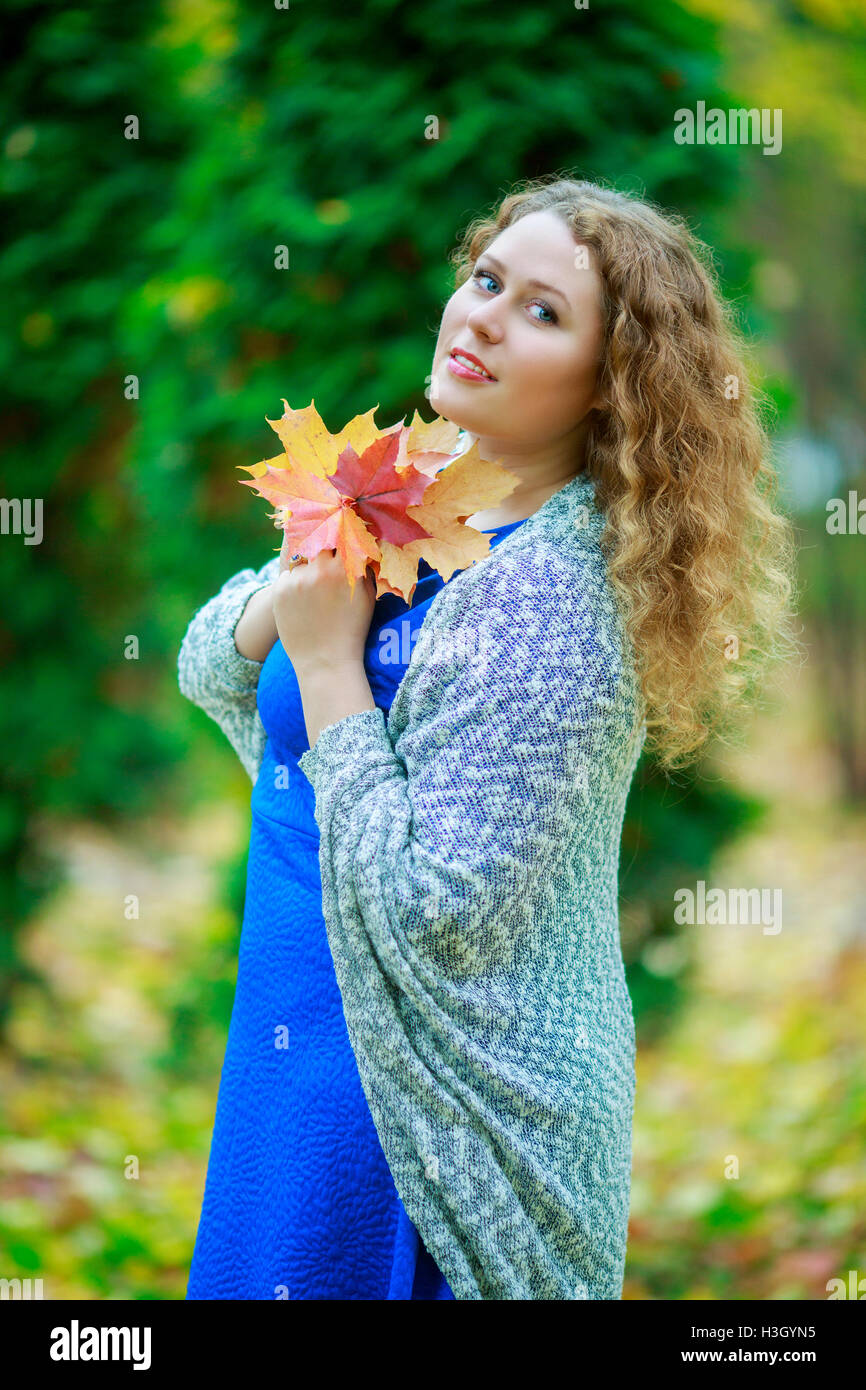 beautiful plus size model in the autumn park Stock Photo - Alamy