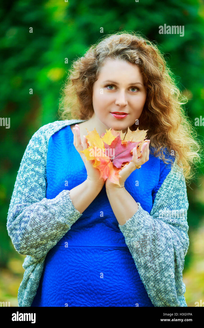 beautiful plus size model in the autumn park Stock Photo - Alamy