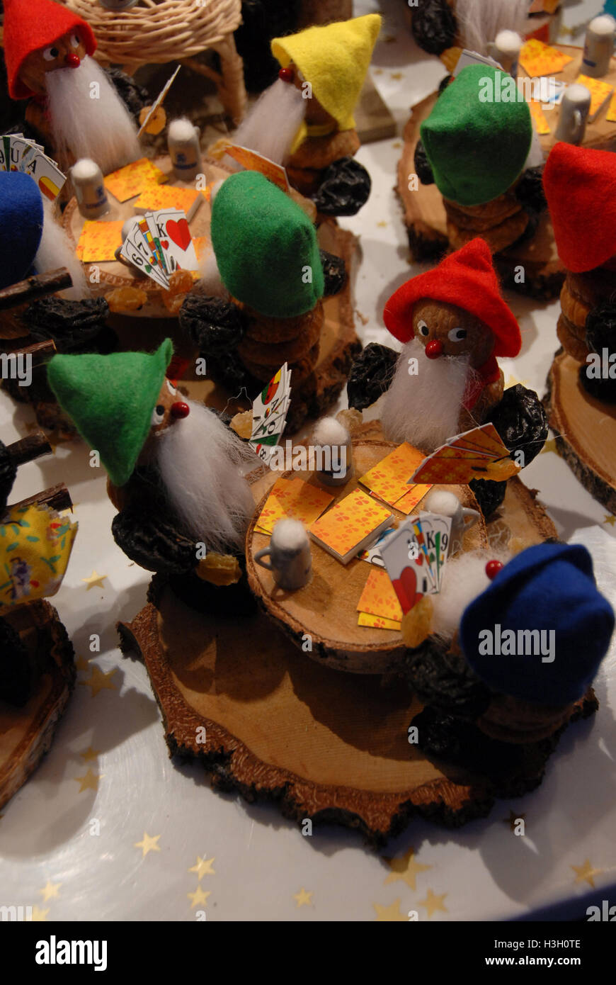 A card game scene of Bavarian handmade models with their beer glasses ...