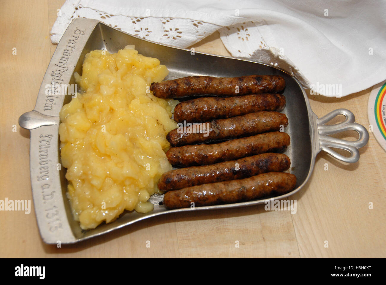 The famous finger-thin Nuremberg Bratwurst (Nuremberg sausage) served ...