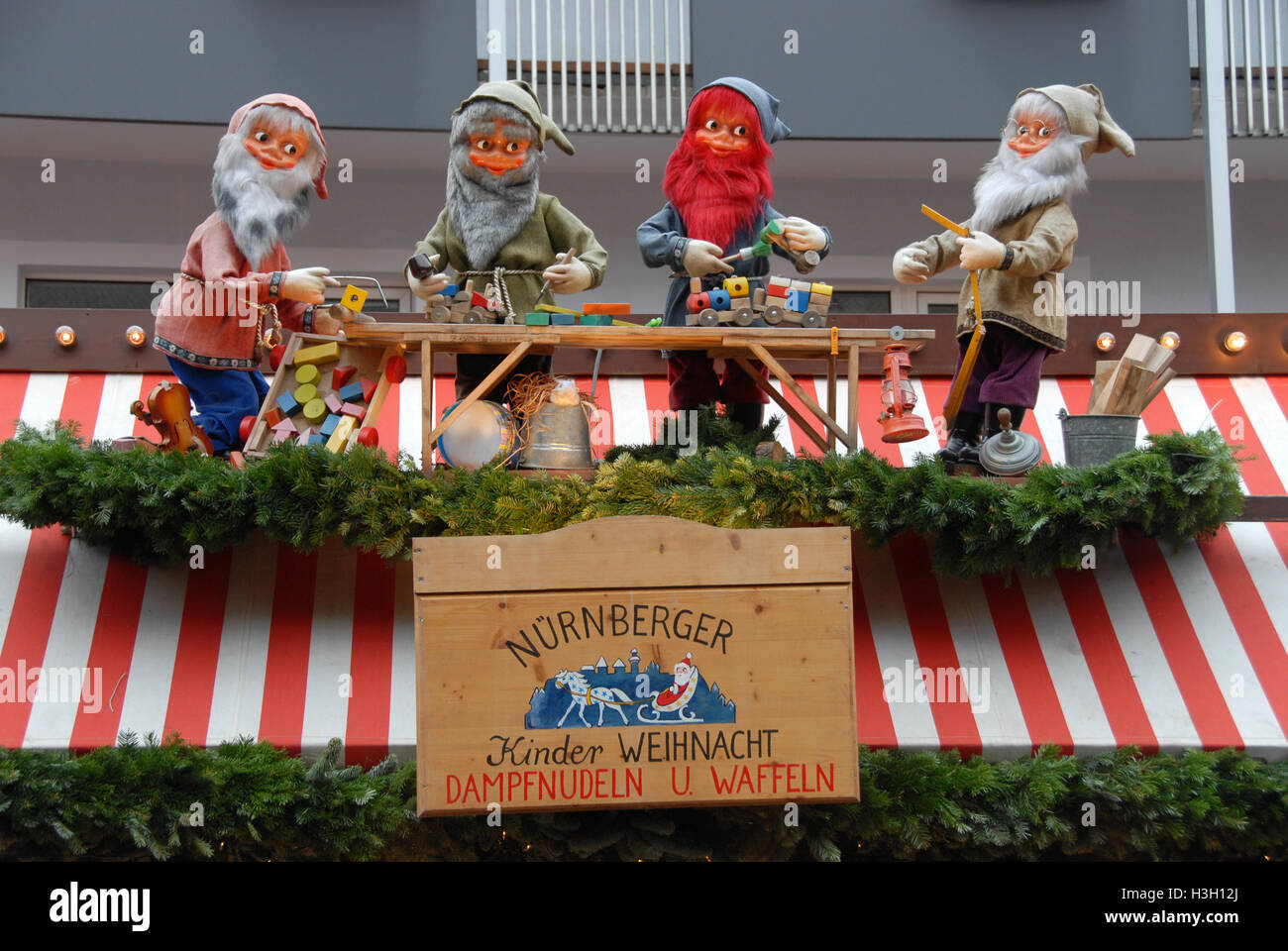 German Christmas puppets on the stall roof of a wooden log hut in the ...