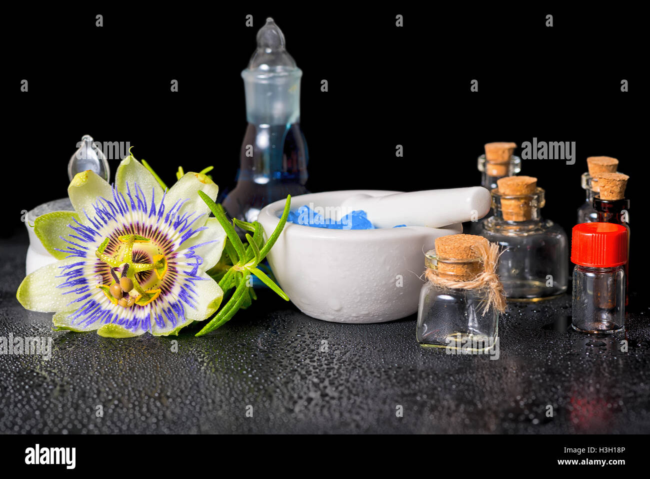 beautiful spa setting of blue passiflora flower, cosmetic salt mortar ...