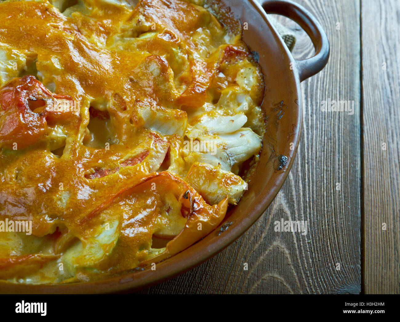 cod gratin with bearnaise sauce.French cuisine Stock Photo - Alamy