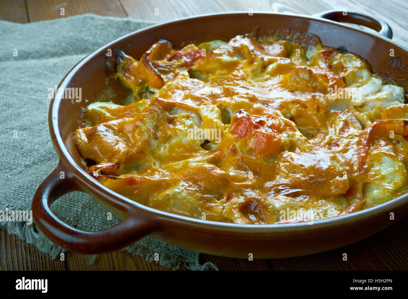 cod gratin with bearnaise sauce.French cuisine Stock Photo - Alamy