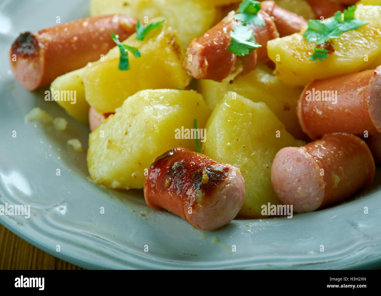 Finnish Fried potatoes with sausages- paistetut perunat Stock Photo - Alamy