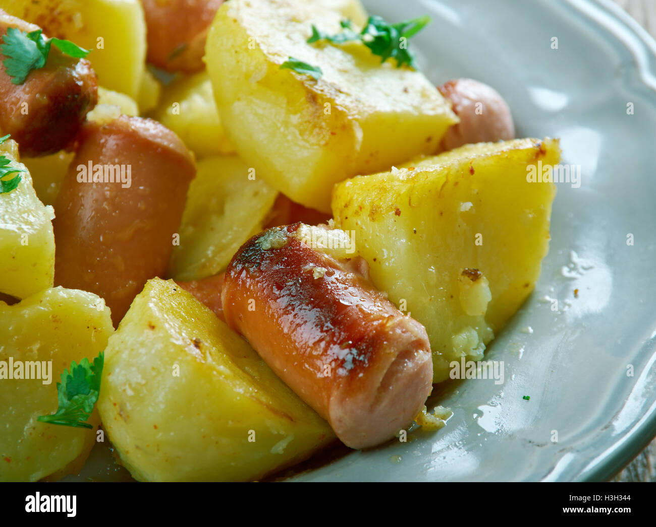 Finnish Fried potatoes with sausages- paistetut perunat Stock Photo - Alamy