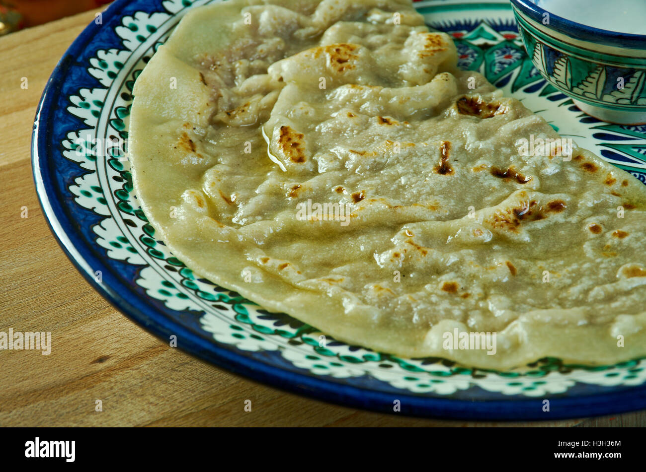 Qutab - Uzbek baked meat pastry Stock Photo - Alamy