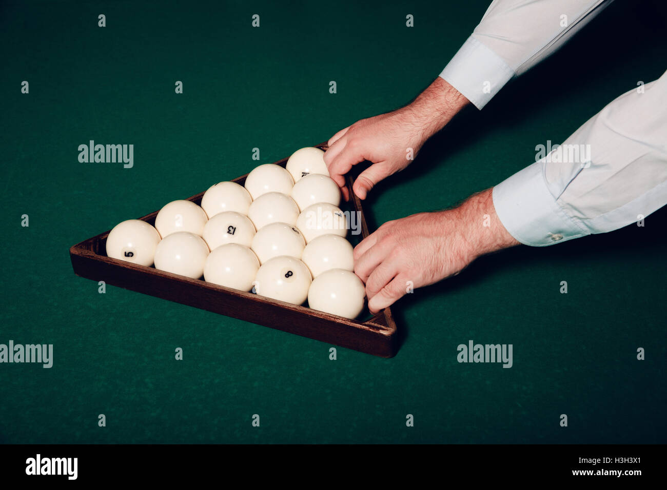 Man preparing billiard balls Stock Photo - Alamy