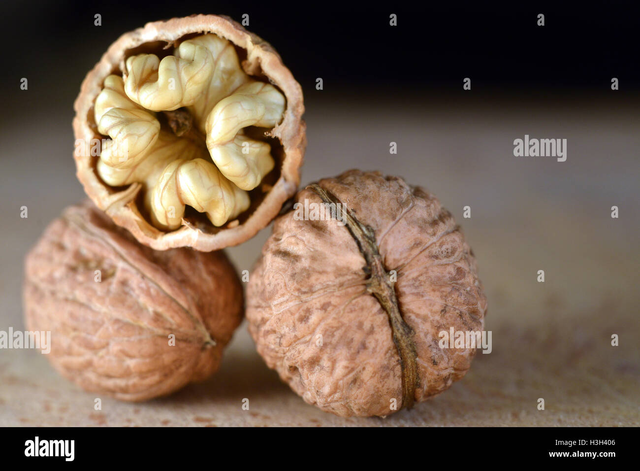 English walnuts with one cracked open Stock Photo - Alamy