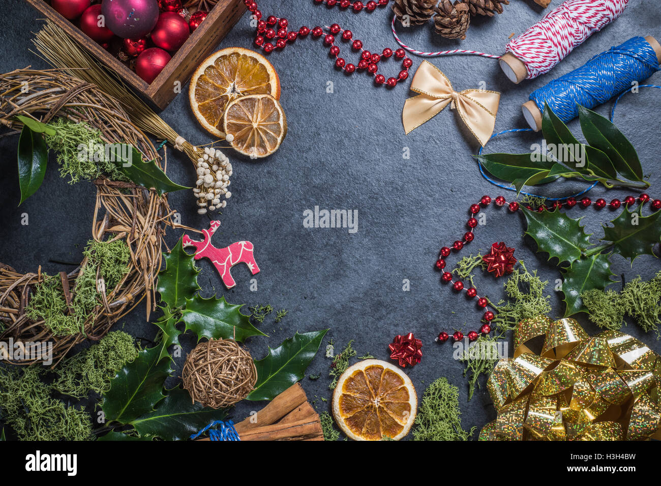Festive home decor for Christmas, making garland Stock Photo - Alamy