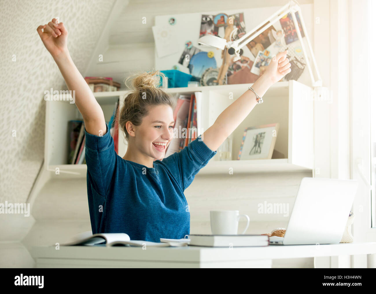 Portrait of an attractive woman at the table with cup and laptop Stock ...