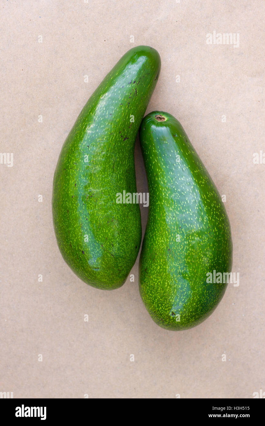 Pair of raw avocados lay on gray background. Yin yang harmony Stock ...