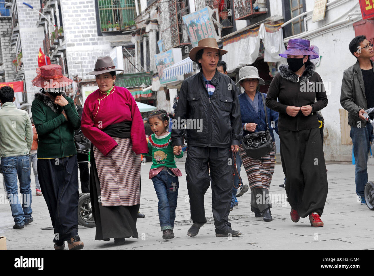Tibetan child holding hands hi-res stock photography and images - Alamy