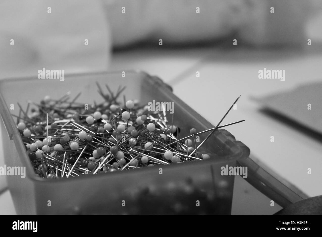 A box of sewing pins sits open on a table Stock Photo - Alamy