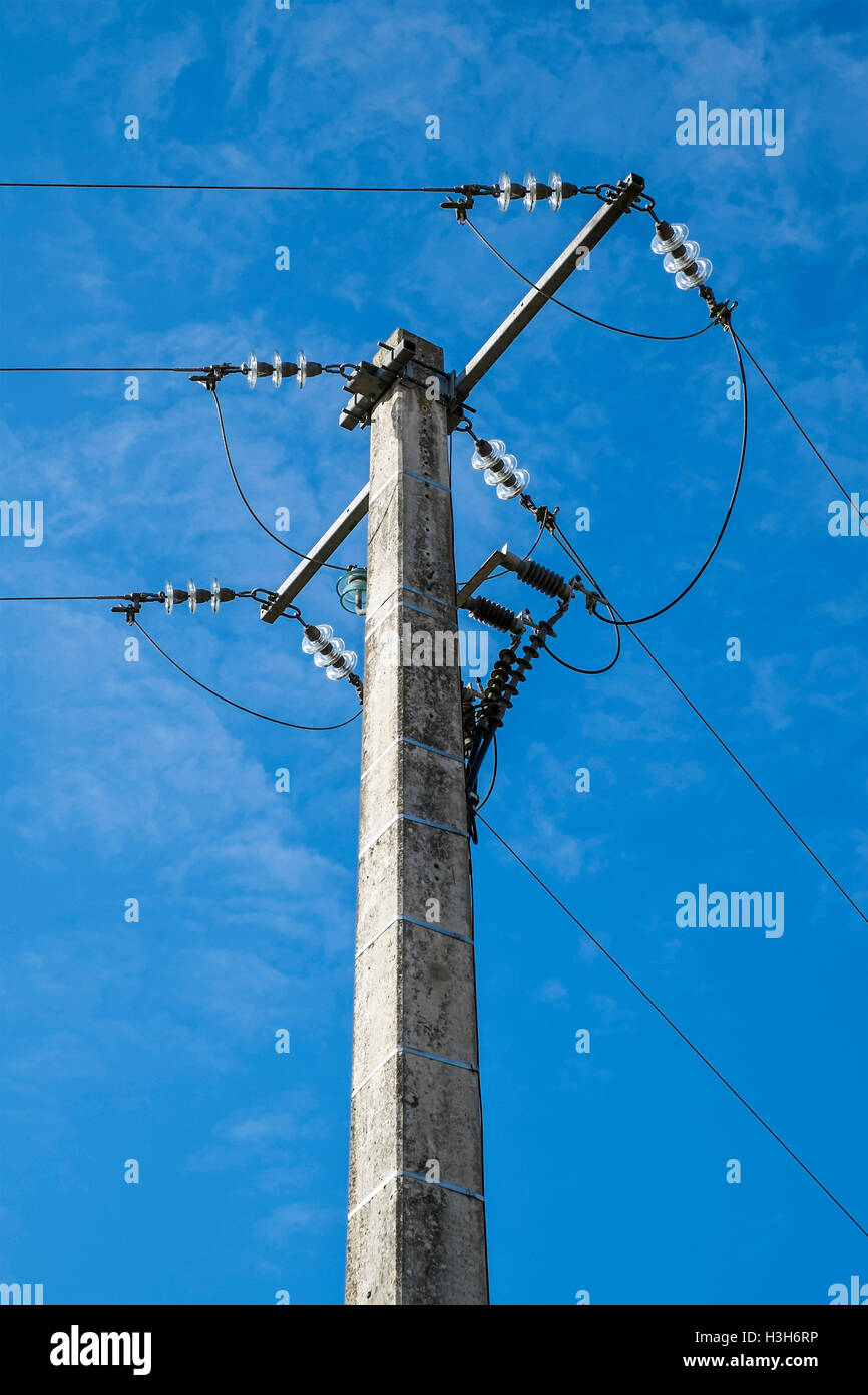 Overhead high-tension electricity wires on concrete post - France Stock ...