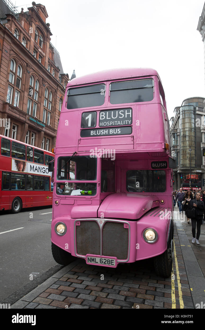 Pink double decker Blush bus in Central London Stock Photo - Alamy