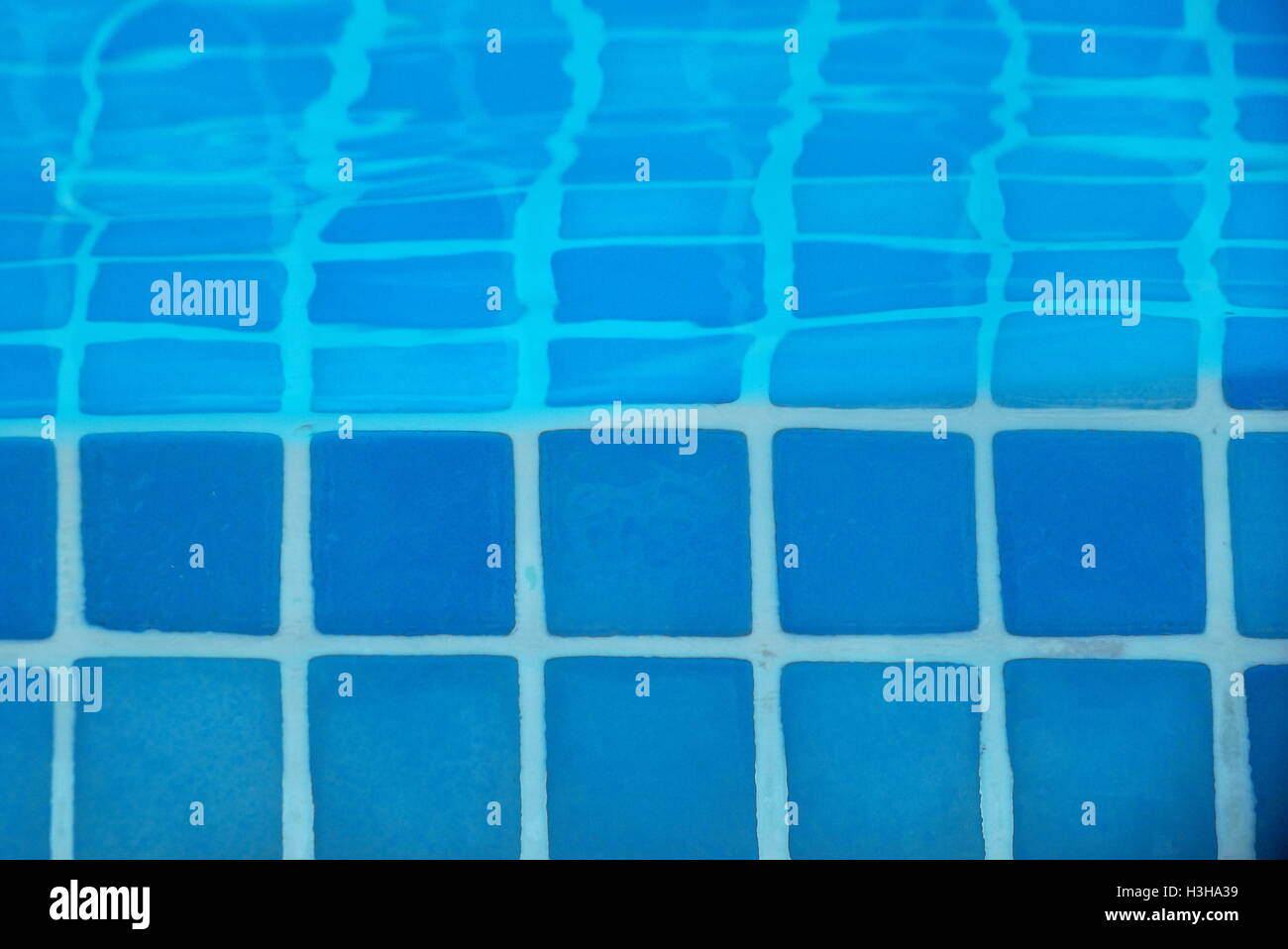 Full frame swimming pool tiles and water Stock Photo - Alamy