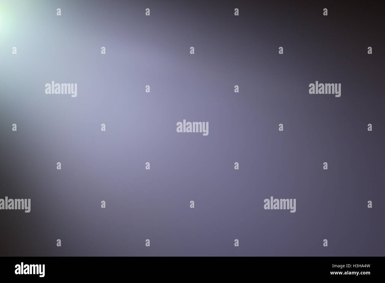 Spotlight diffused on dark blue background Stock Photo - Alamy