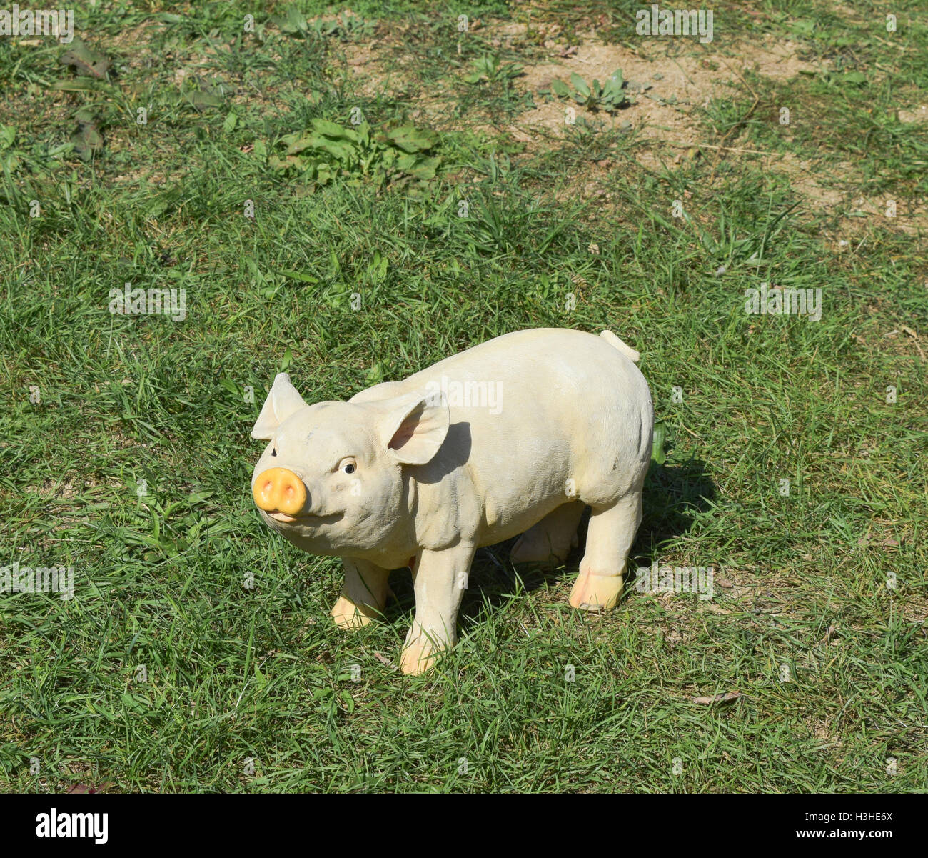 Plastic toy pig. Figures pigs on the lawn Stock Photo - Alamy