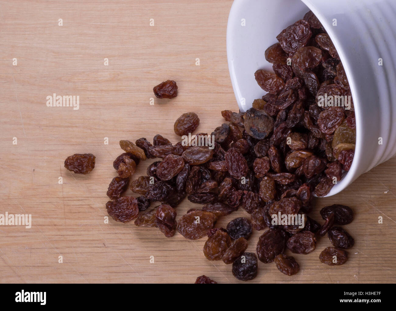Dark raisins on a table Stock Photo - Alamy