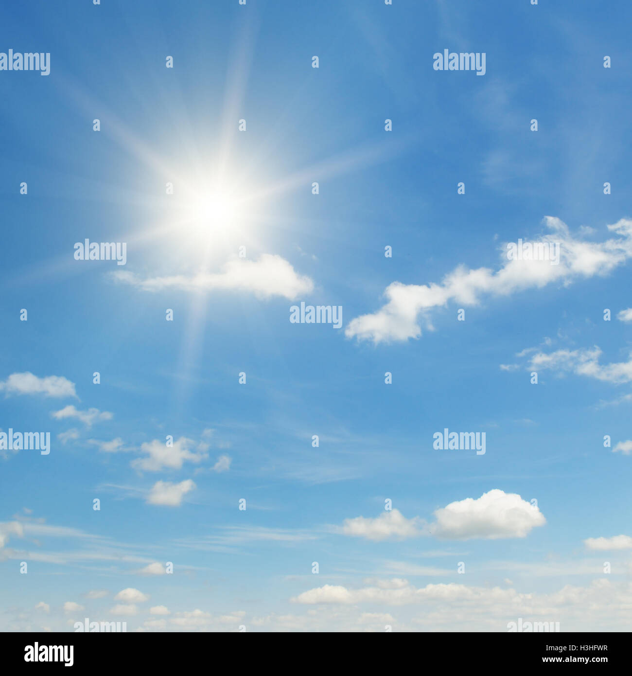sun on beautiful blue sky Stock Photo - Alamy
