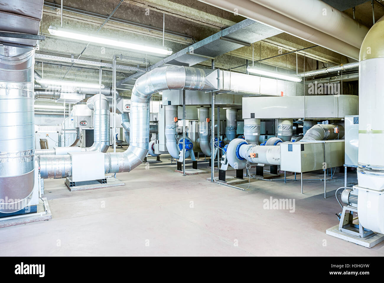 under the roof of a large building, there is a technical room with ...