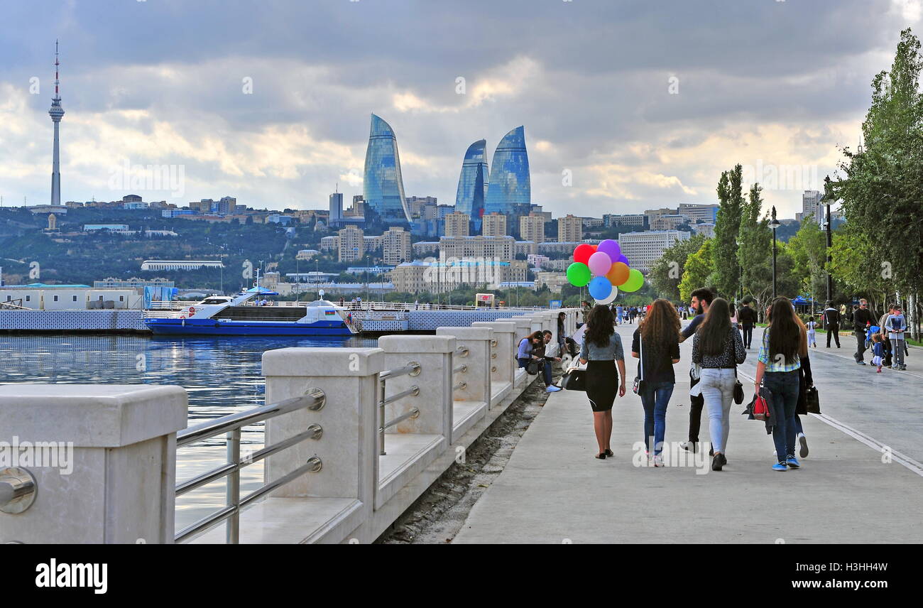 BAKU, AZERBAIJAN - SEPTEMBER 25: People goes by the seafront of Baku on ...