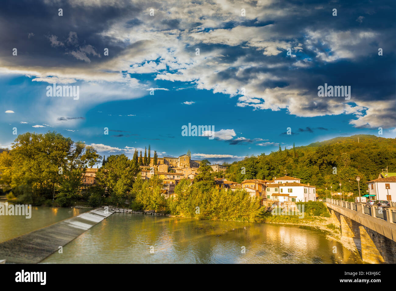 Typical ancient medieval village on river in Italy Stock Photo - Alamy