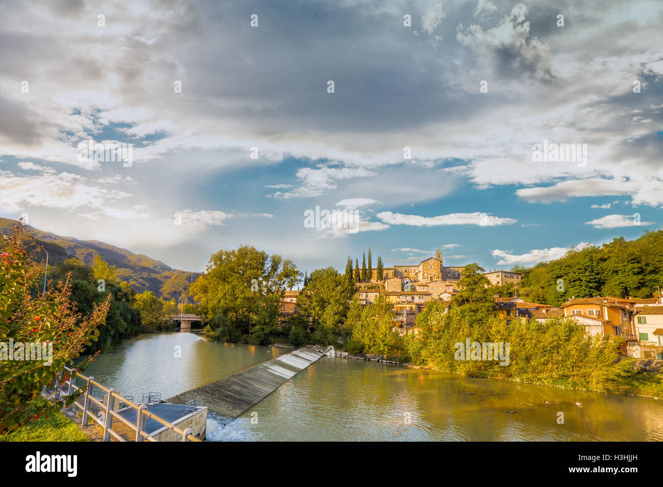 Typical ancient medieval village on river in Italy Stock Photo - Alamy