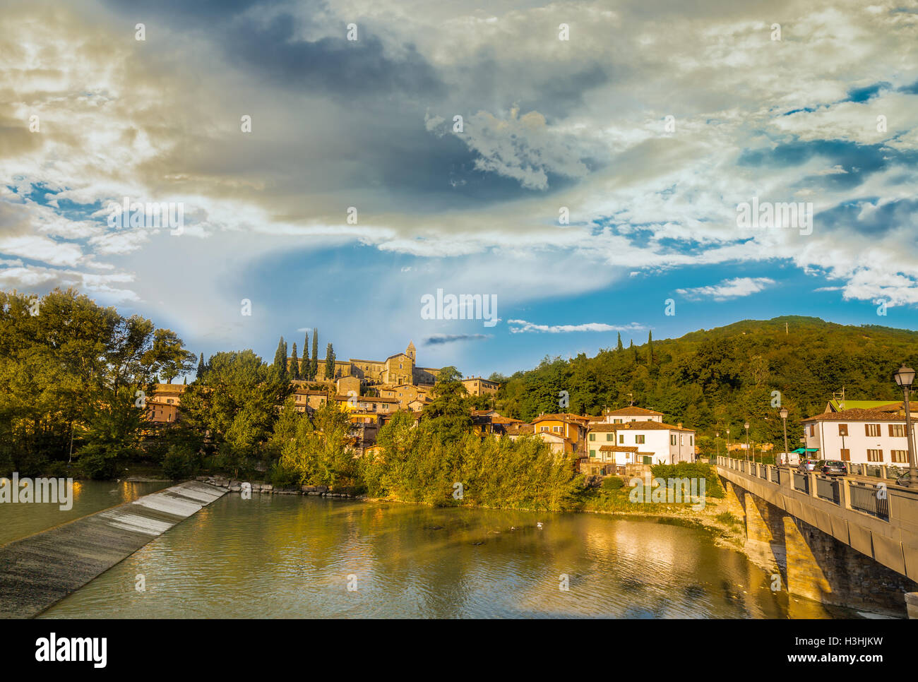 Typical ancient medieval village on river in Italy Stock Photo - Alamy