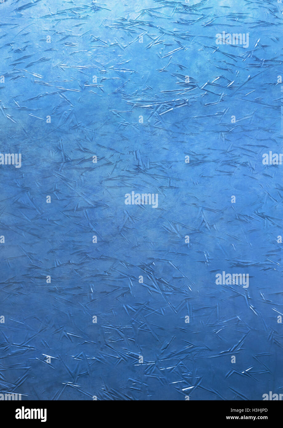 Icy surface on a sea with splitting highlights from the winter sun with ...