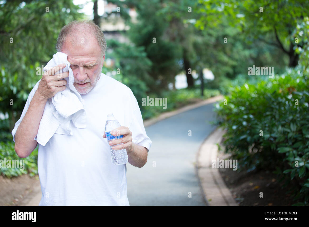 Closeup portrait, old gentleman in white shirt having difficulties with ...