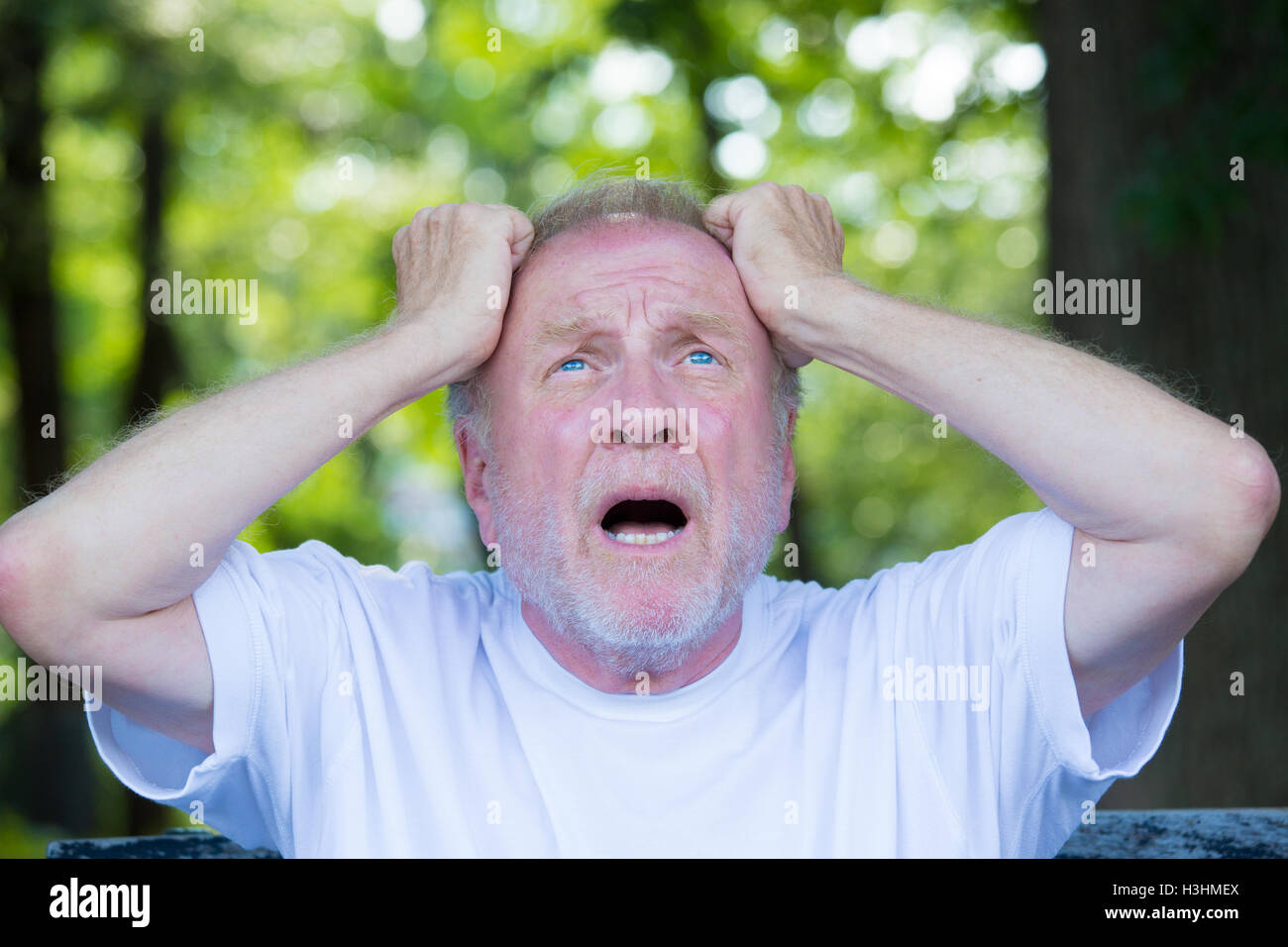 Closeup portrait, old guy with goatee in white shirt, frustrated, wide ...