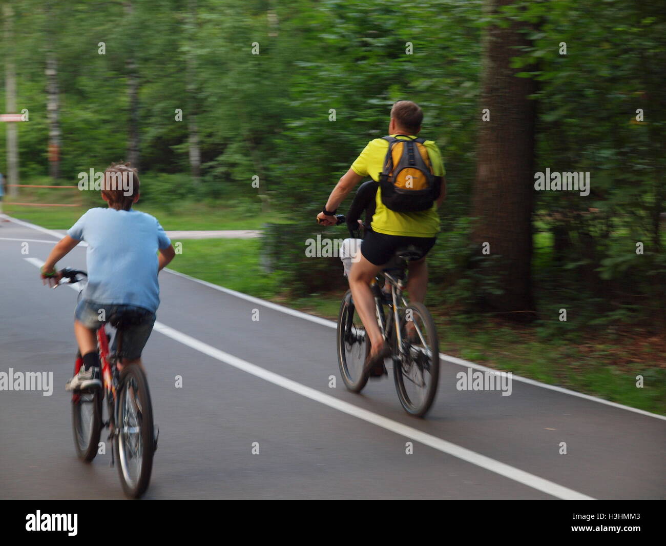 Happy family On Cycle in the park Stock Photo - Alamy