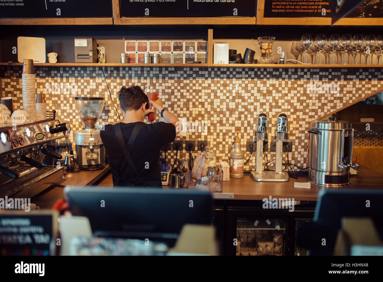Barista at work in a coffee shop Stock Photo - Alamy